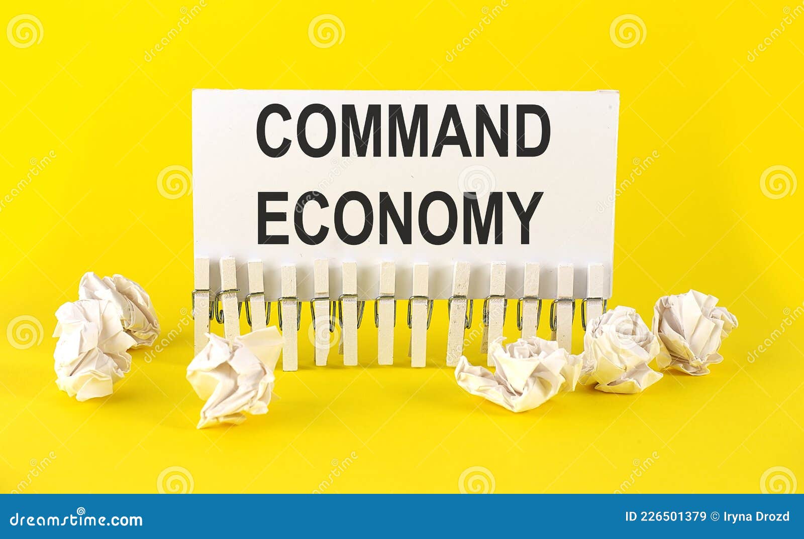 Text COMMAND ECONOMY on the White Short Note Paper Yellow Background ...