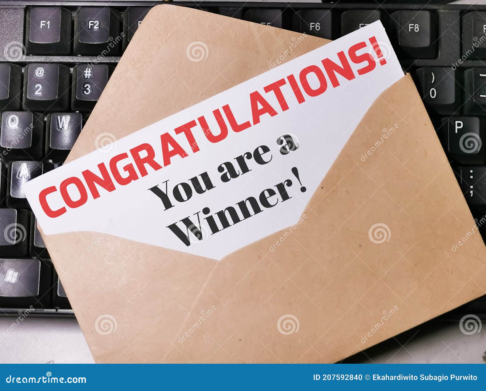 Text CONGRATULATIONS YOU are a WINNER Written on White Paper Note in ...