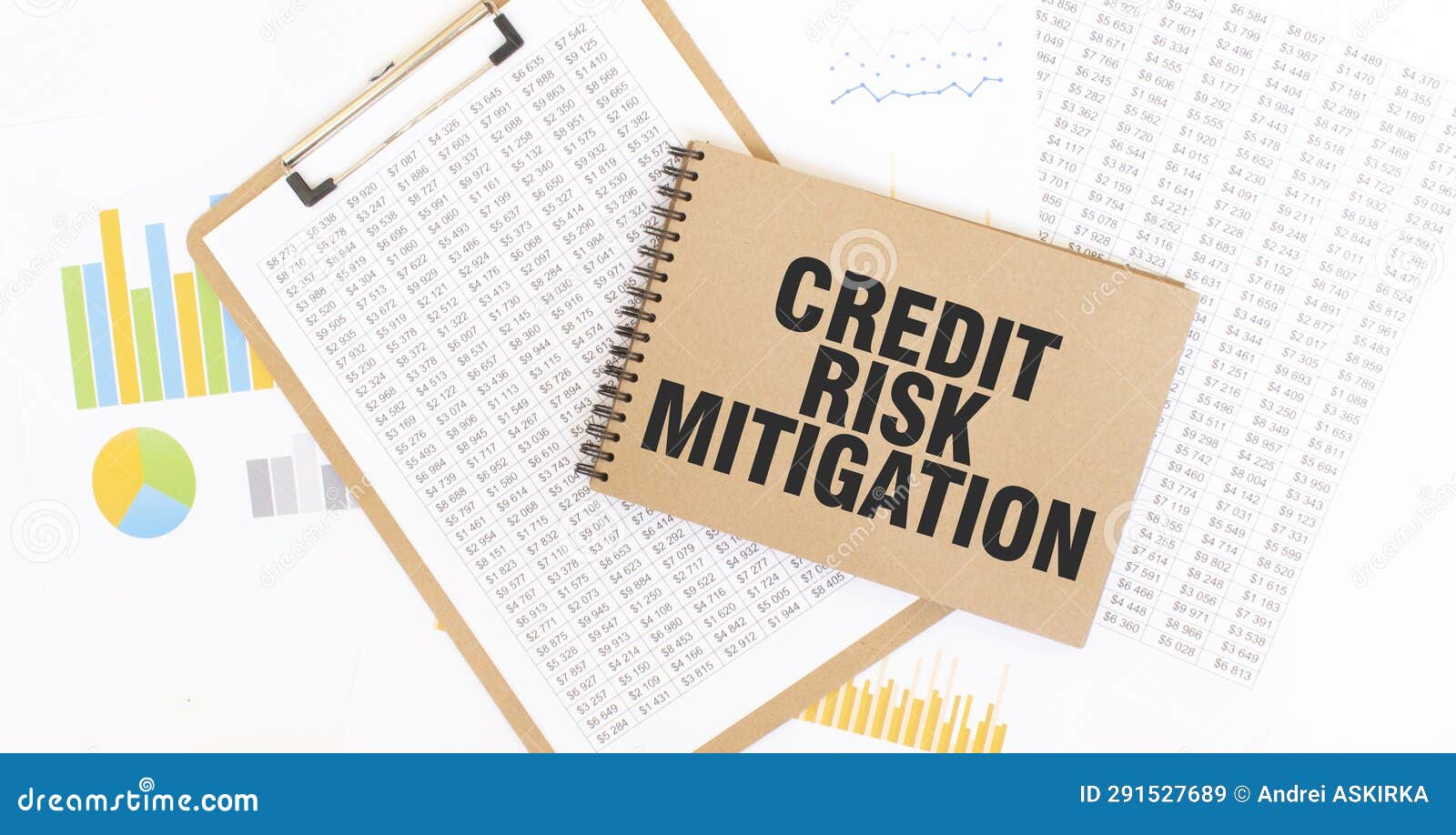 Text CREDIT RISK MITIGATION on Brown Paper Notepad on the Table with ...