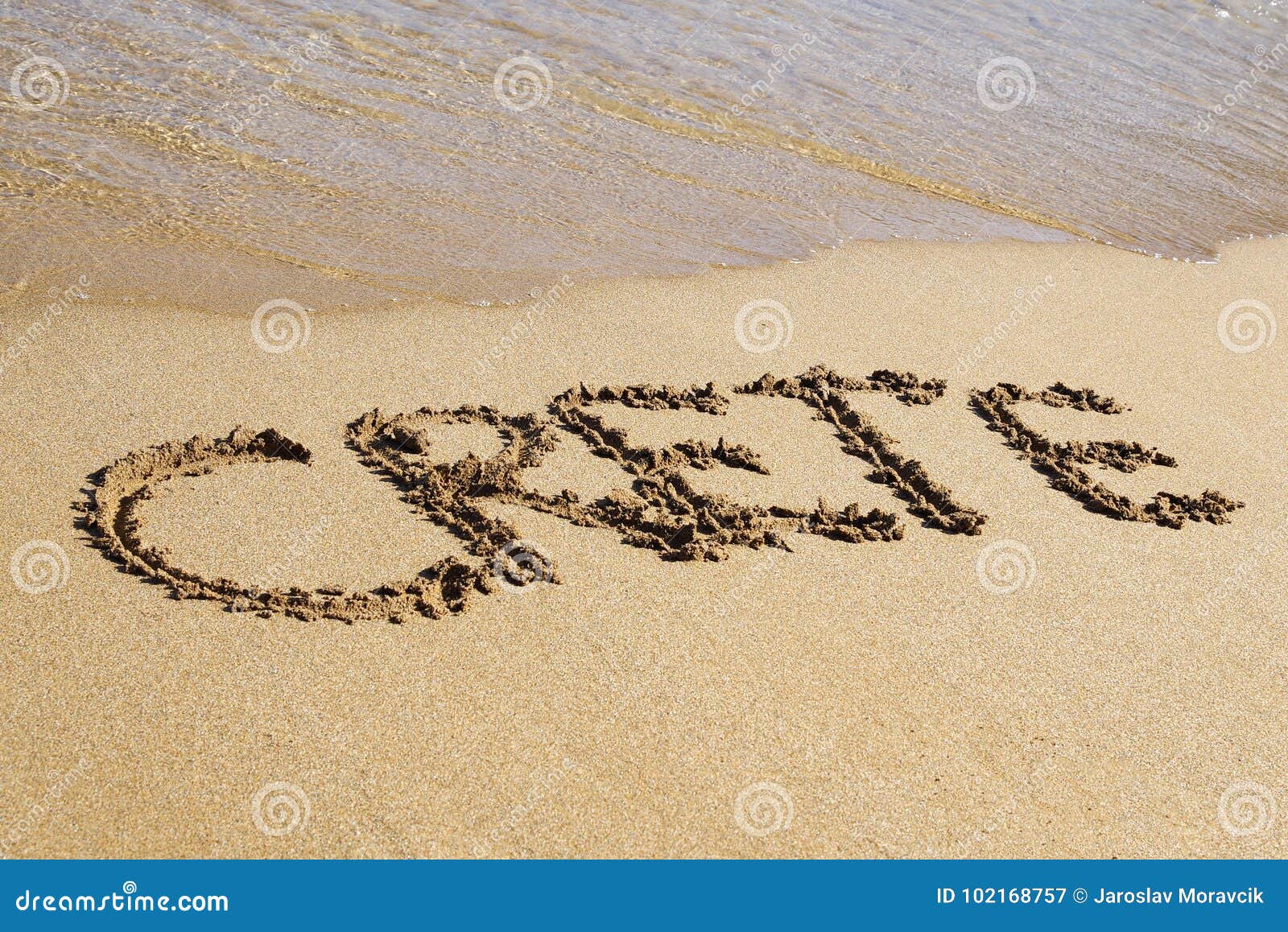 Text CRETE written in sand stock image. Image of water - 102168757