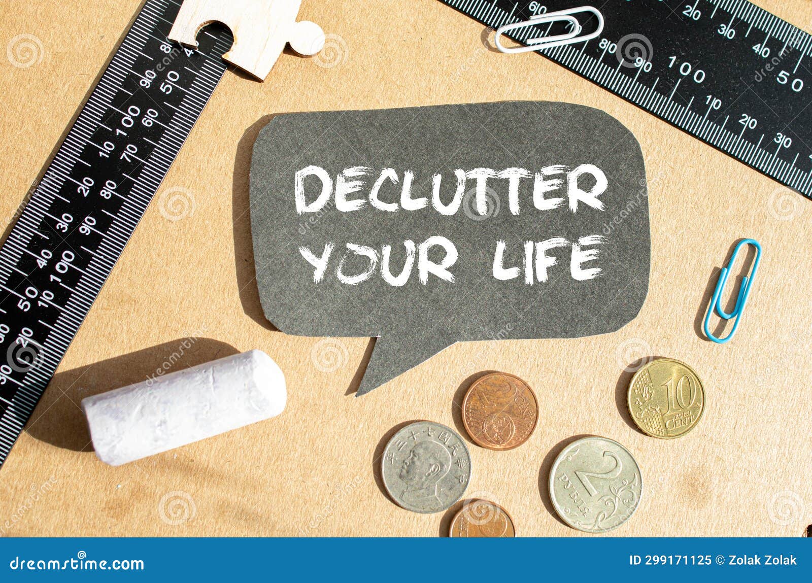 The Text DECLUTTER YOUR LIFE Appears on Torn Lilac Paper Against a ...