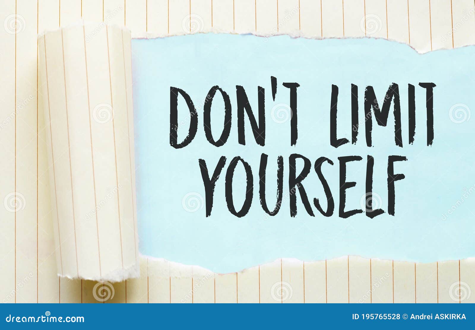 The Text DONT LIMIT YOURSELF Appearing Behind Torn White Paper Stock ...