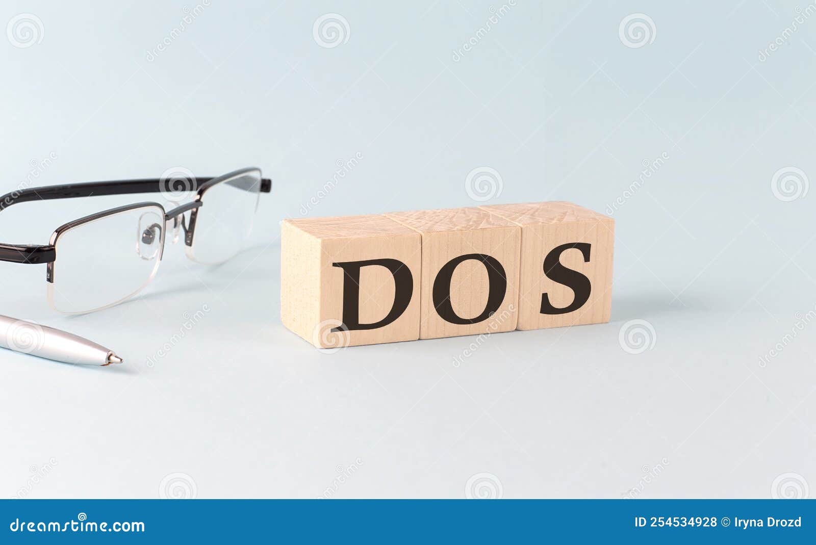 Text DOS - Disk Operating System - Written on the Wooden Cubes on Blue ... Text DOS - Disk Operating System - Written on the Wooden Cubes on Blue ...