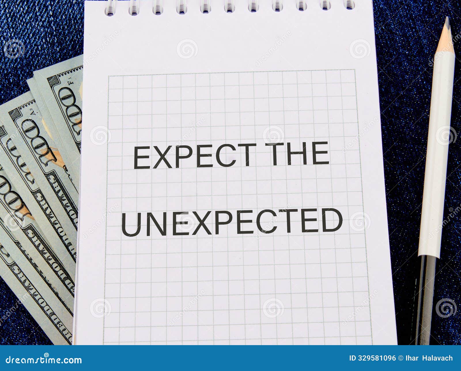 Text Expect the Unexpected in a Notebook in a Composition with American ...