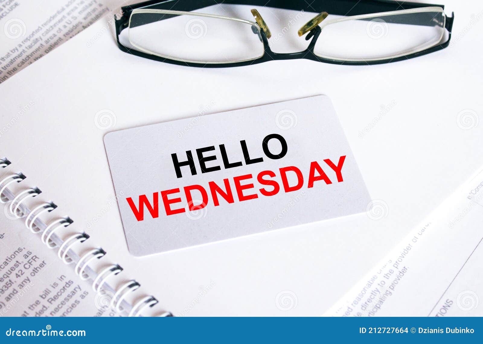 Text Hello Wednesday on a Business Card Lying on a Notepad with ...