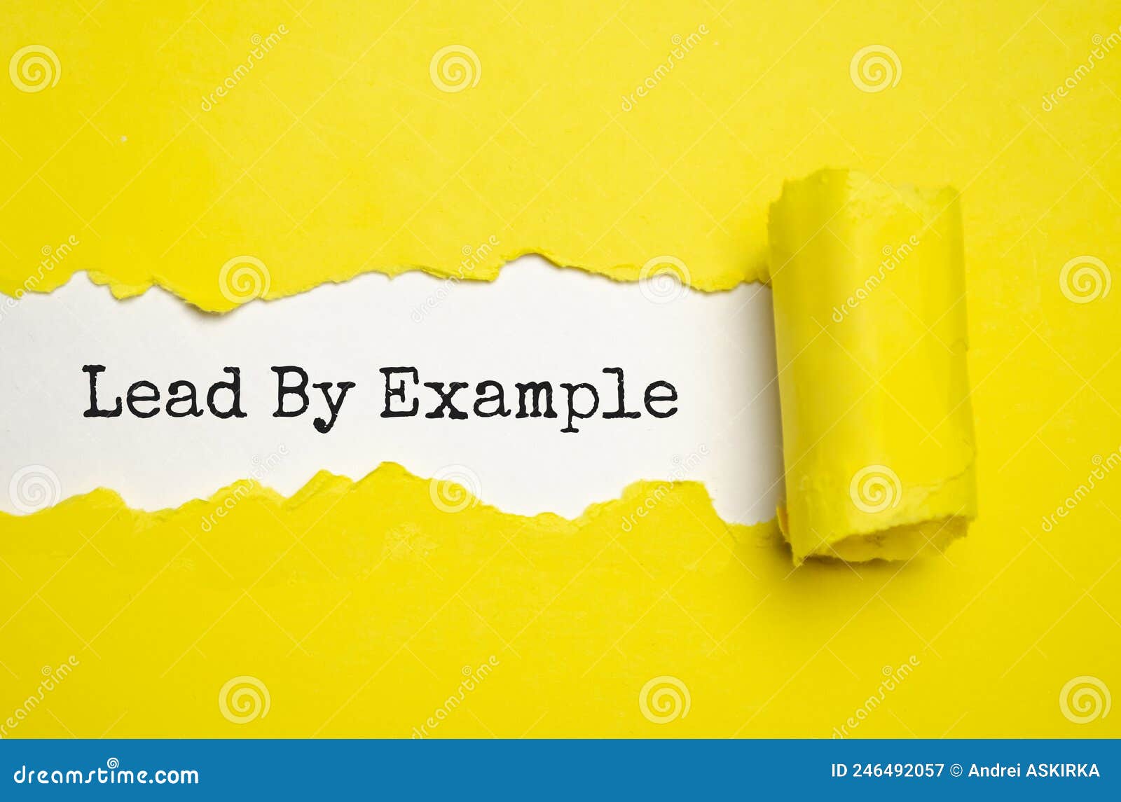 The Text Lead by Example Appearing Behind Torn Brown Paper Stock Image ...