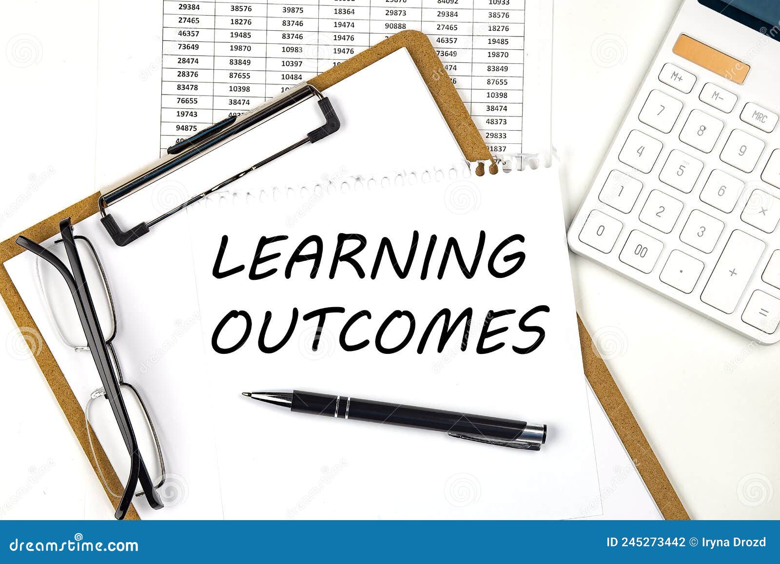 Text LEARNING OUTCOMES on the White Paper on Clipboard with Chart and ...