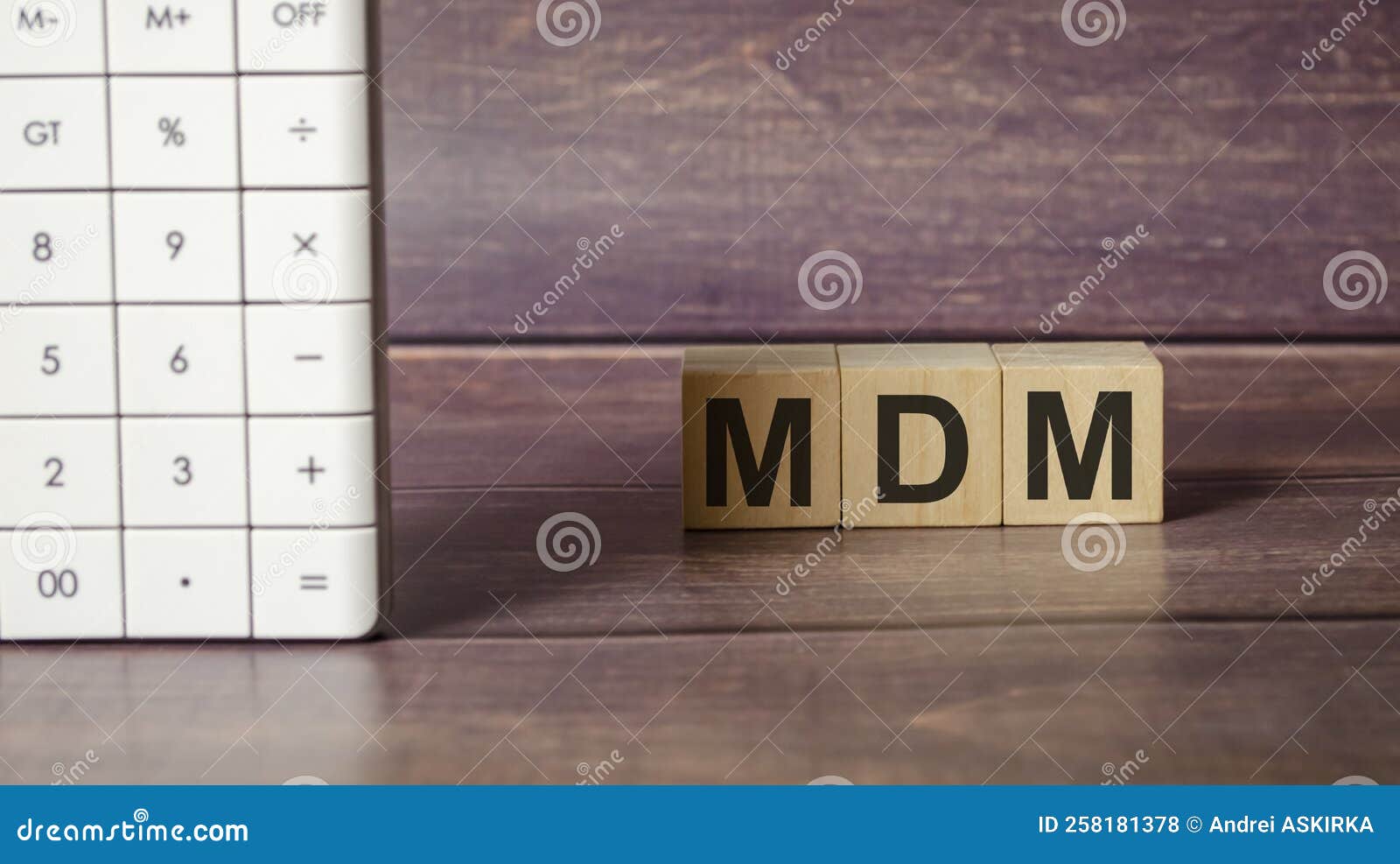 Text MDM As MOBILE DEVICE MANAGEMENT on Wooden Blocks and Calculator ...
