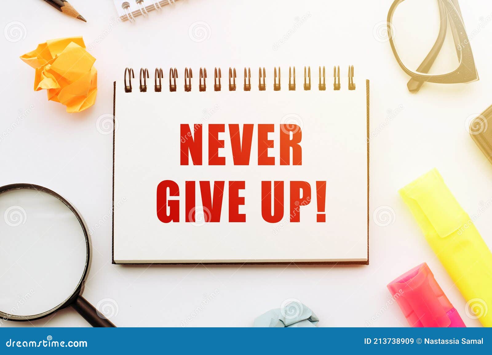 Text Never Give Up in Notebook on White Table with Office Tools Stock ...