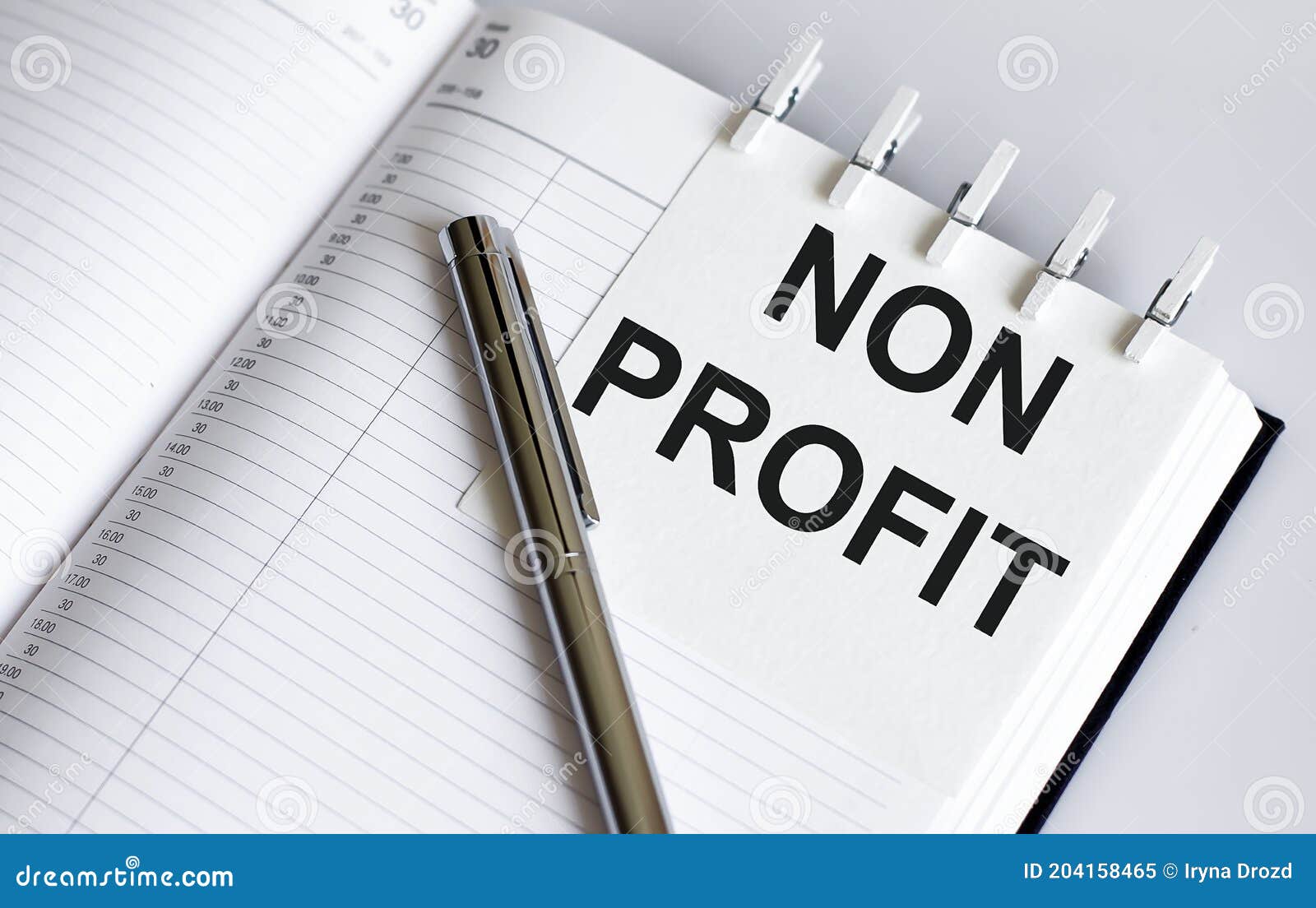 Text NON PROFIT on the Short Note Texture Background with Pen Stock ...