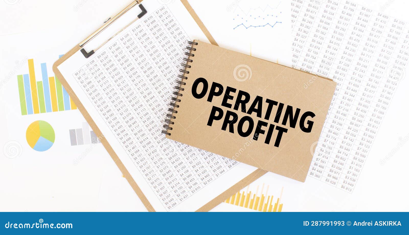 Text OPERATING PROFIT on Brown Paper Notepad on the Table with Diagram ...