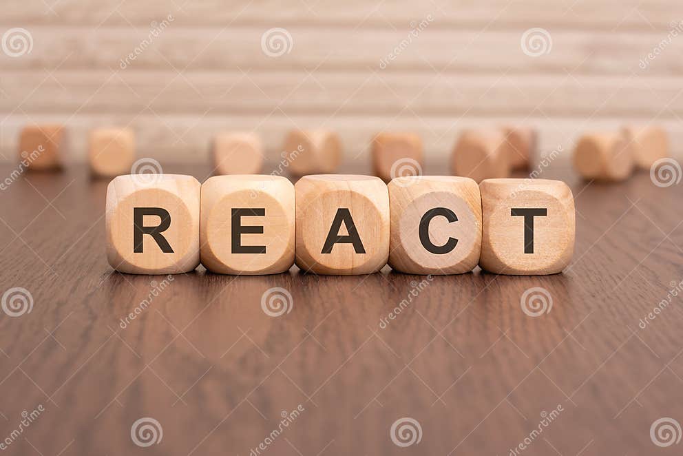 The Text REACT is Written on Wooden Cubes on a Brown Background Stock ...