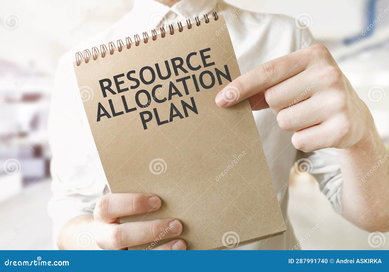 Text RESOURCE ALLOCATION PLAN on Brown Paper Notepad in Businessman ...
