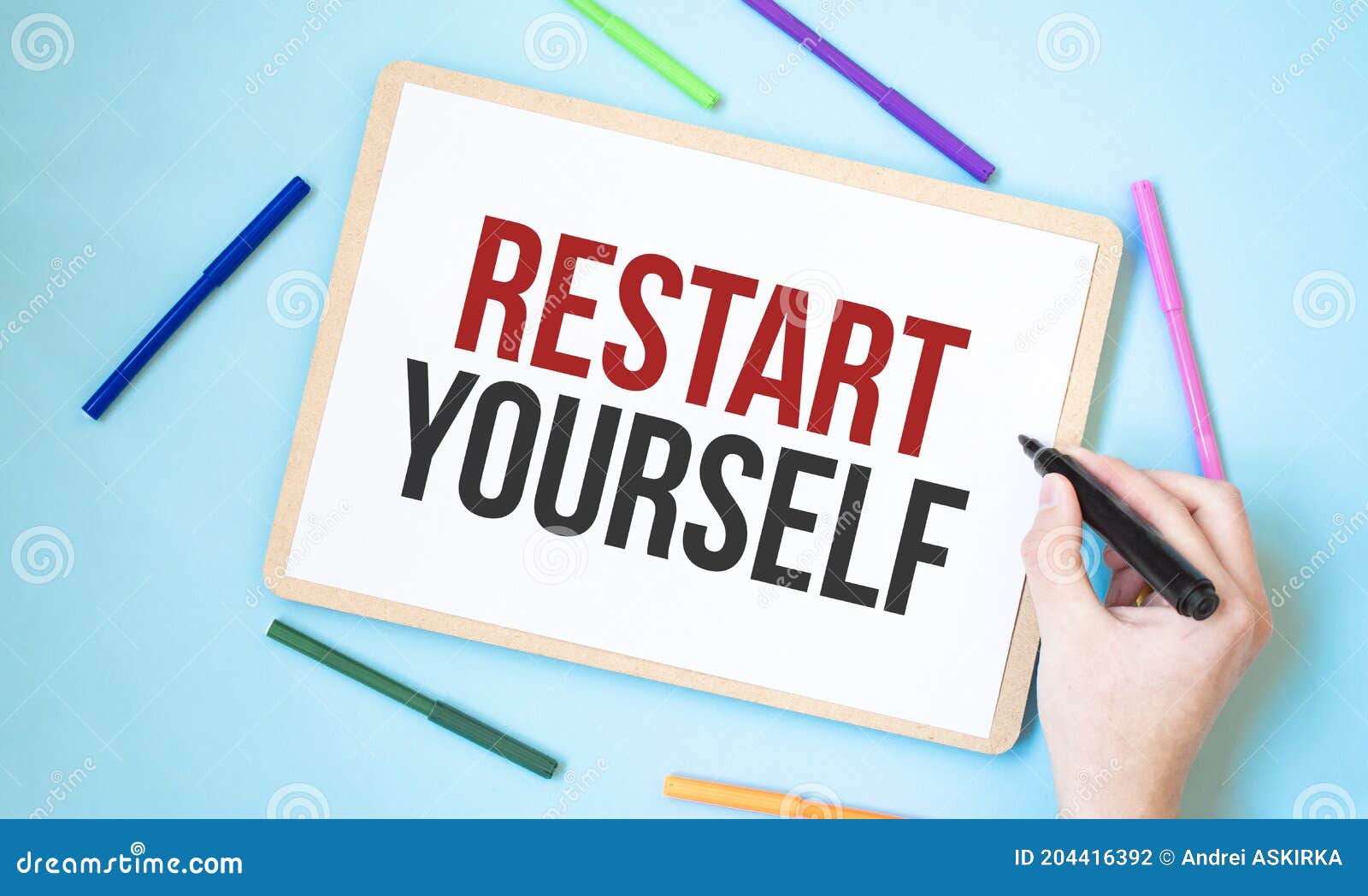 Text Restart Yourself on a Notebook Surrounded by Colored Felt-tip Pens ...