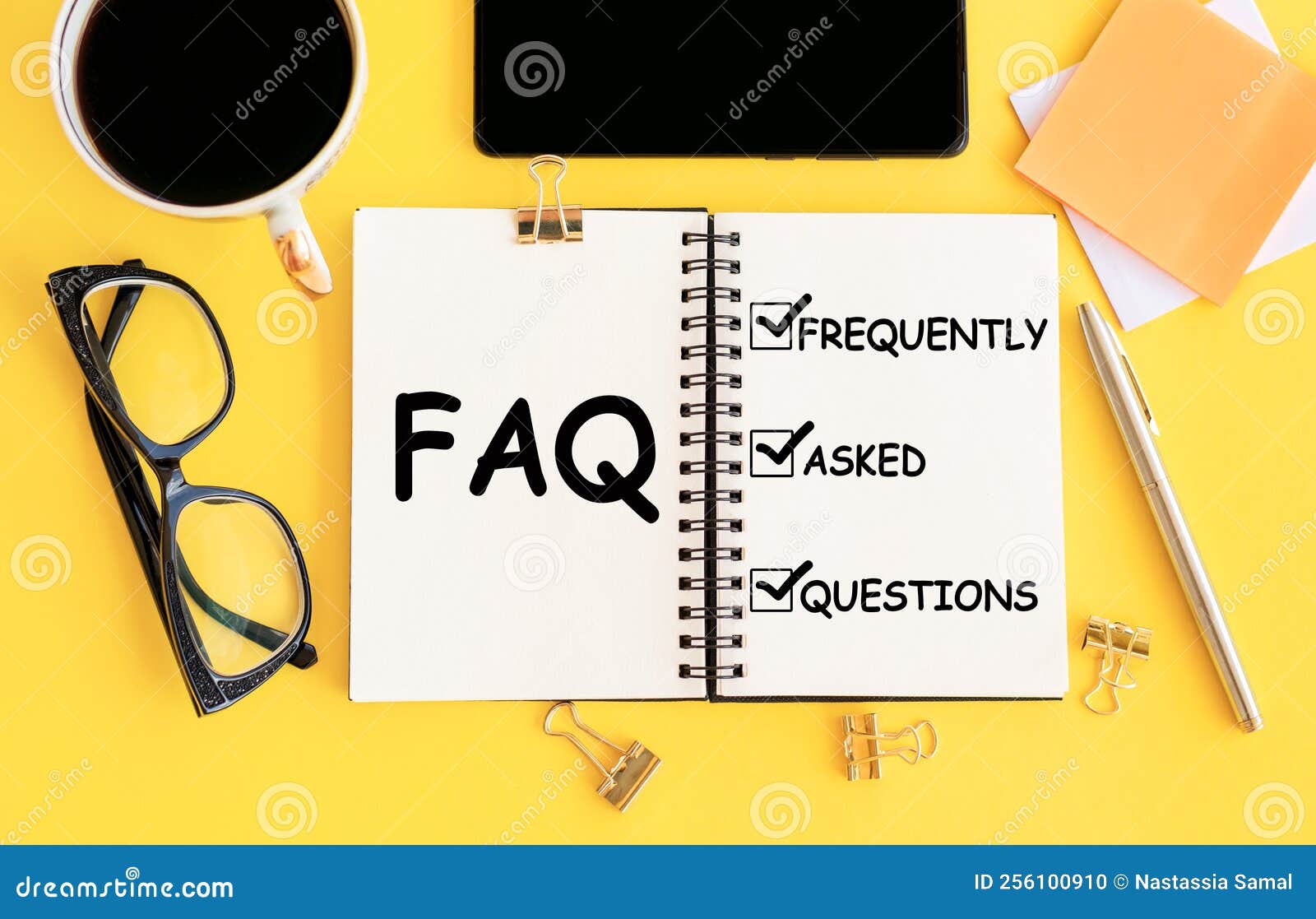Text Sign Showing FAQ with Office Tools and Coffee on the Yellow ...