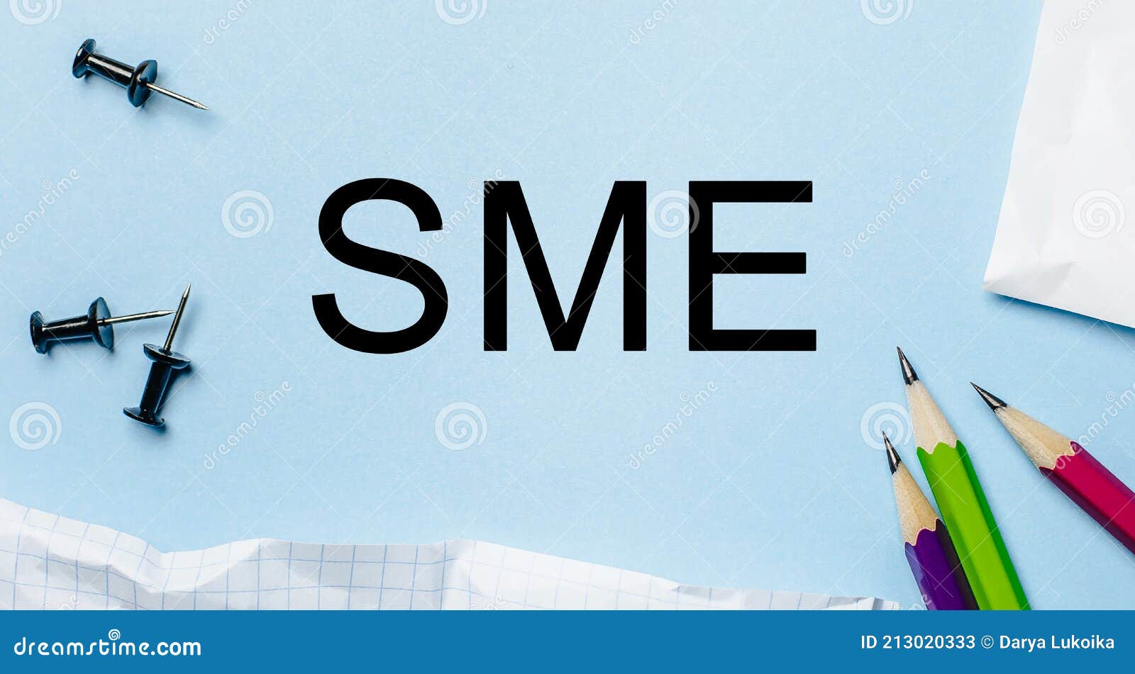 Text Sme on a White Notepad with Pencils on a Blue Background. Business ...