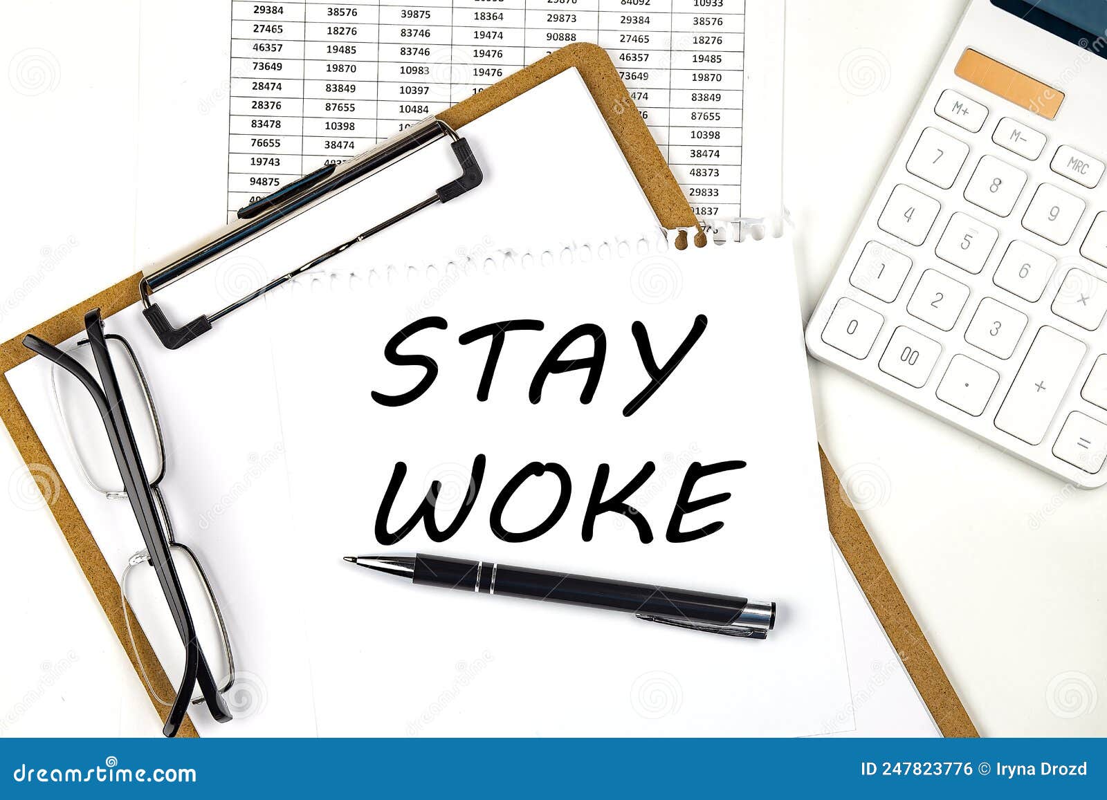 Text STAY WOKE on the White Paper on Clipboard with Chart and ...