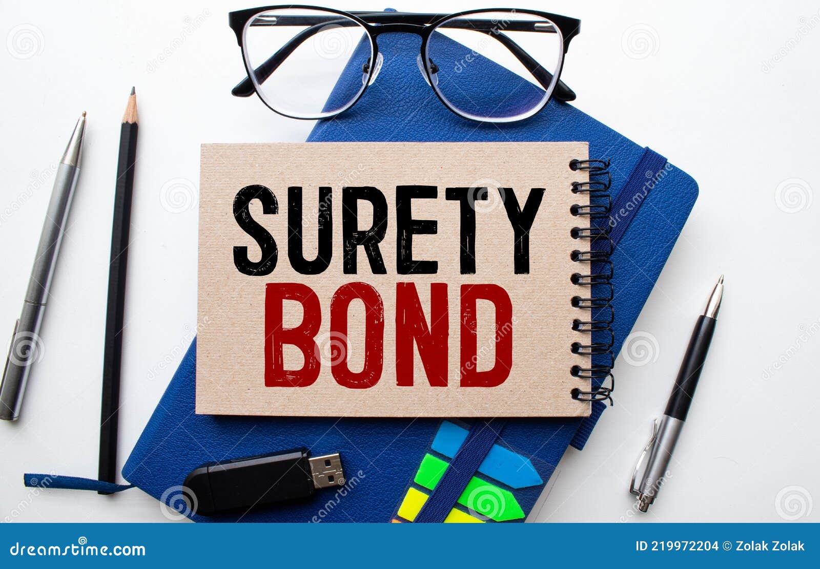 Text SURETY BOND is Written on a Notebook with a Pen and a Magnifying ...
