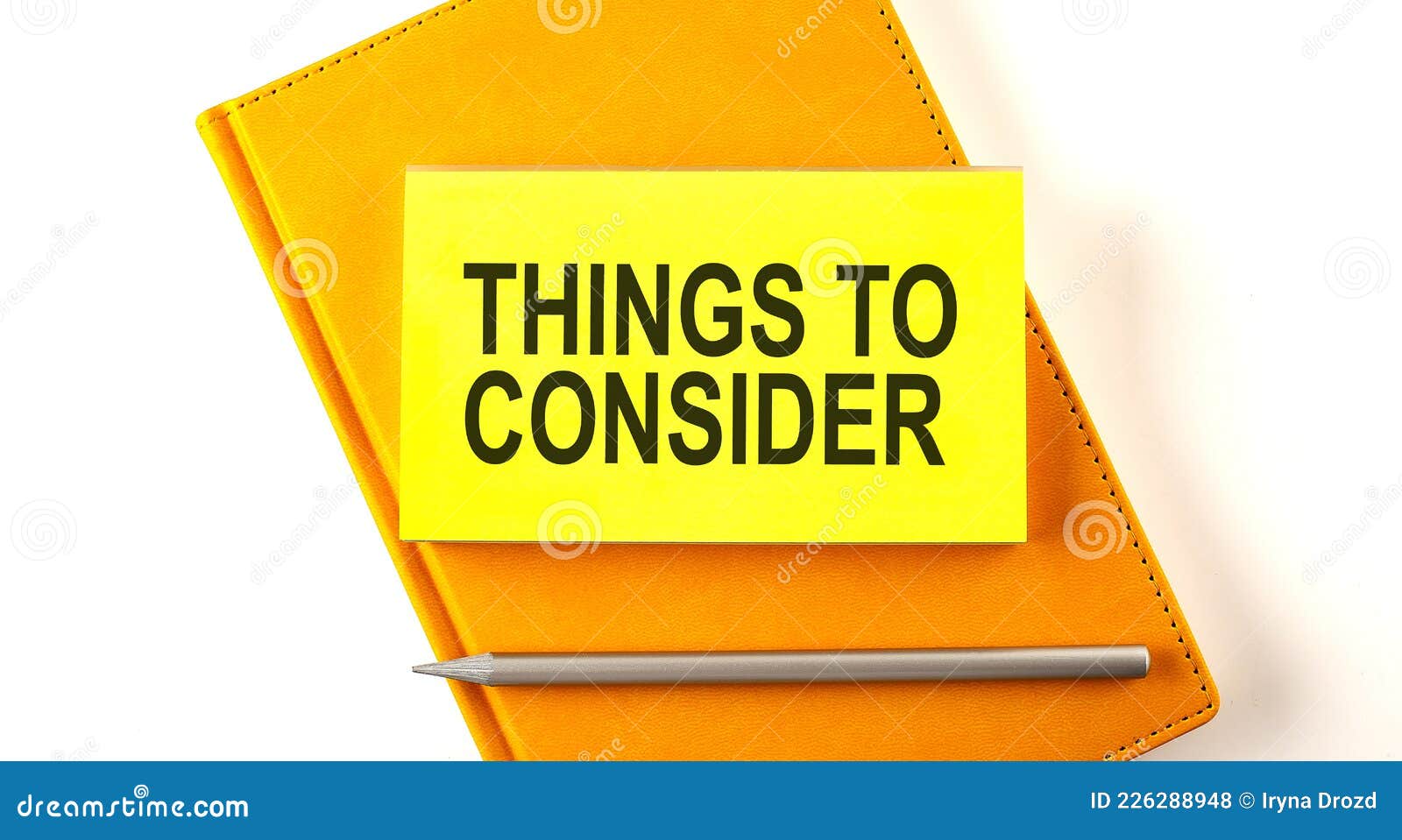 Text THINGS TO CONSIDER on Sticker on the Yellow Notebook Stock Photo ...