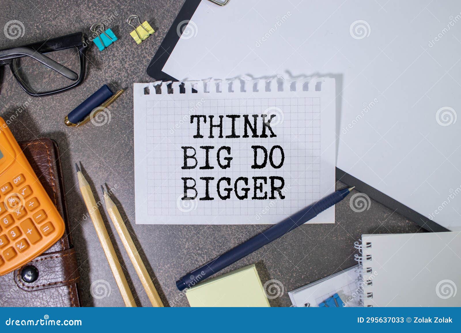 Text THINK BIG DO BIGGER on White Paper on Clipboard with Chart and ...