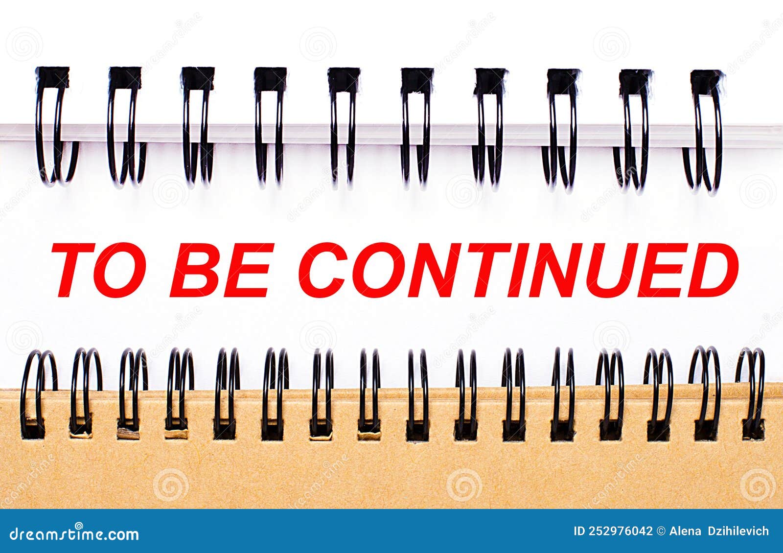 Text TO BE CONTINUED on White Paper between White and Brown Spiral ...