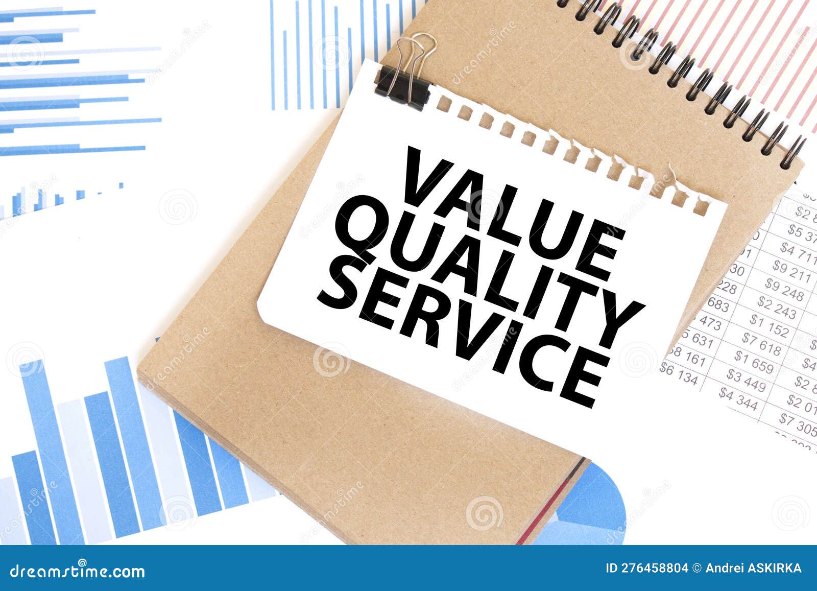 Text Value Quality Service on White Paper Sheet and Brown Paper Notepad ...