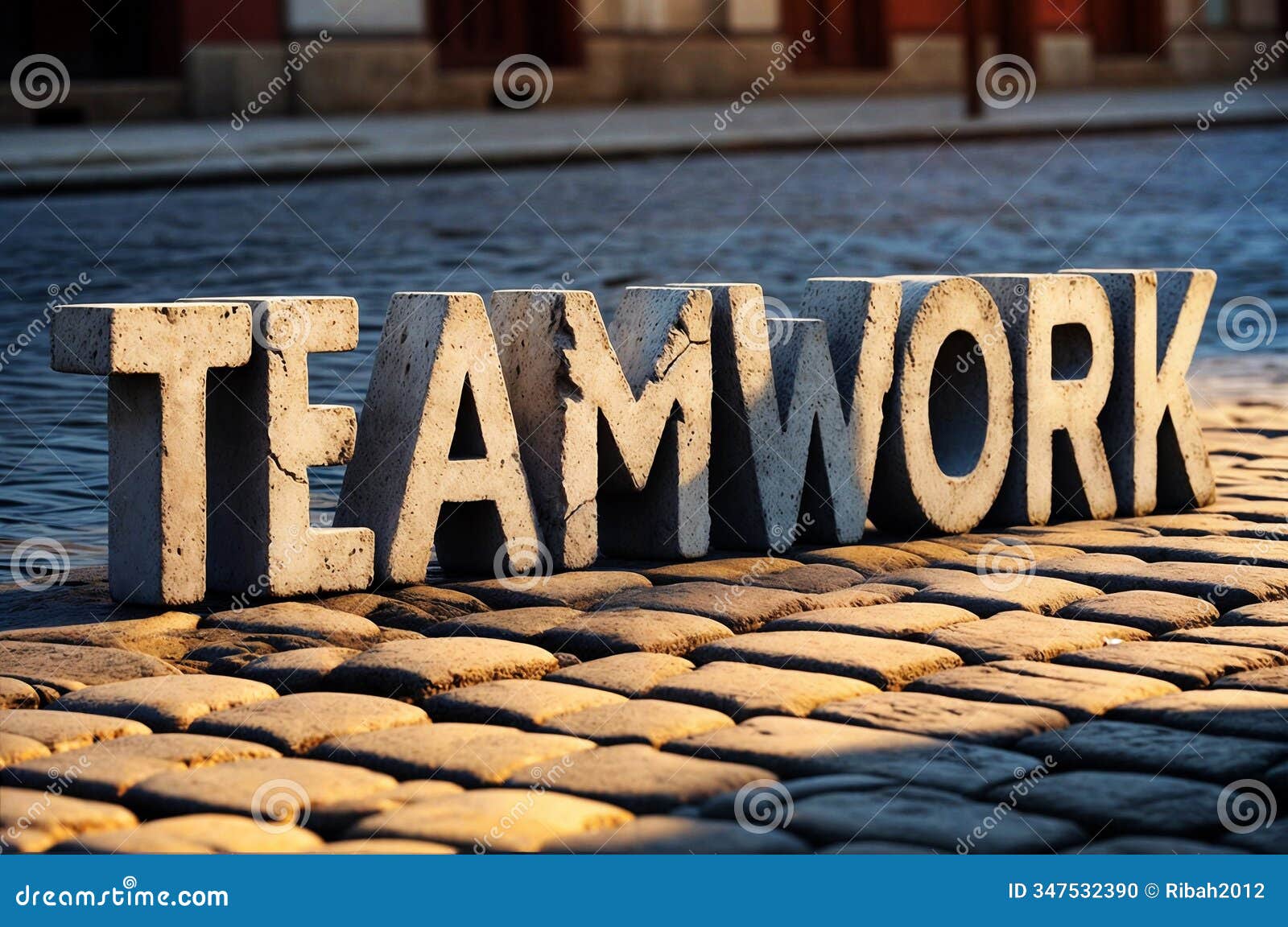 Text Word "TEAMWORK" in Large, Concrete Letters on Cobblestone Road ...