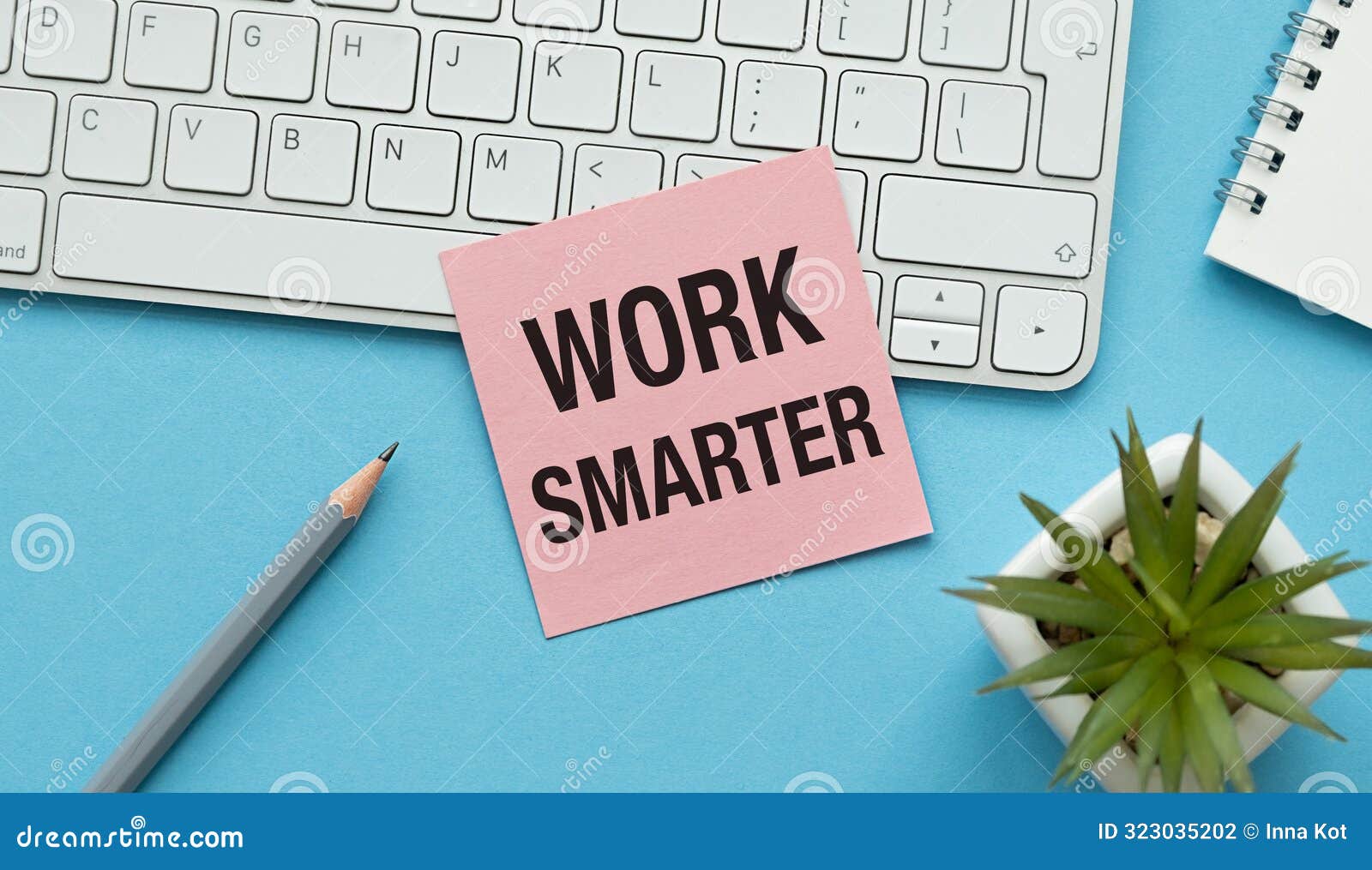 Text Work Smarter on a Pink Sticker Lying on a Keyboard on a Blue ...