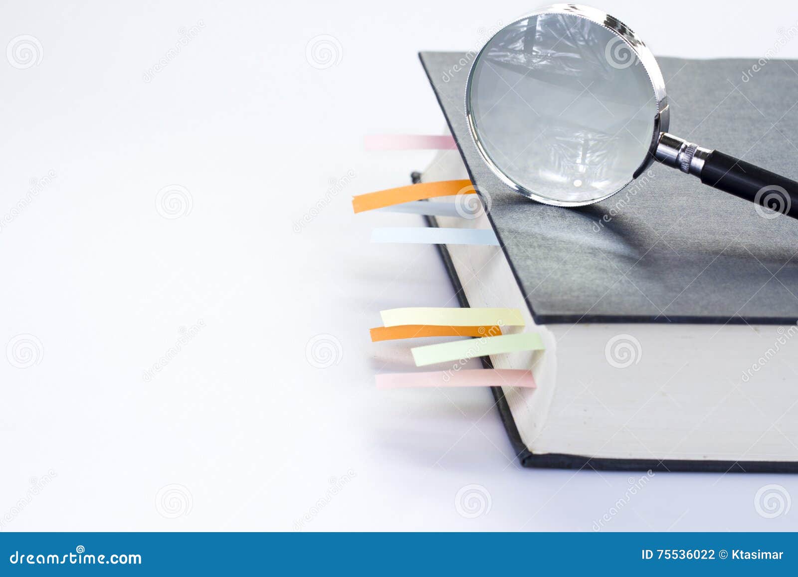 Textbook with Multicolor Bookmarks and Magnifying Glass Stock Photo ...