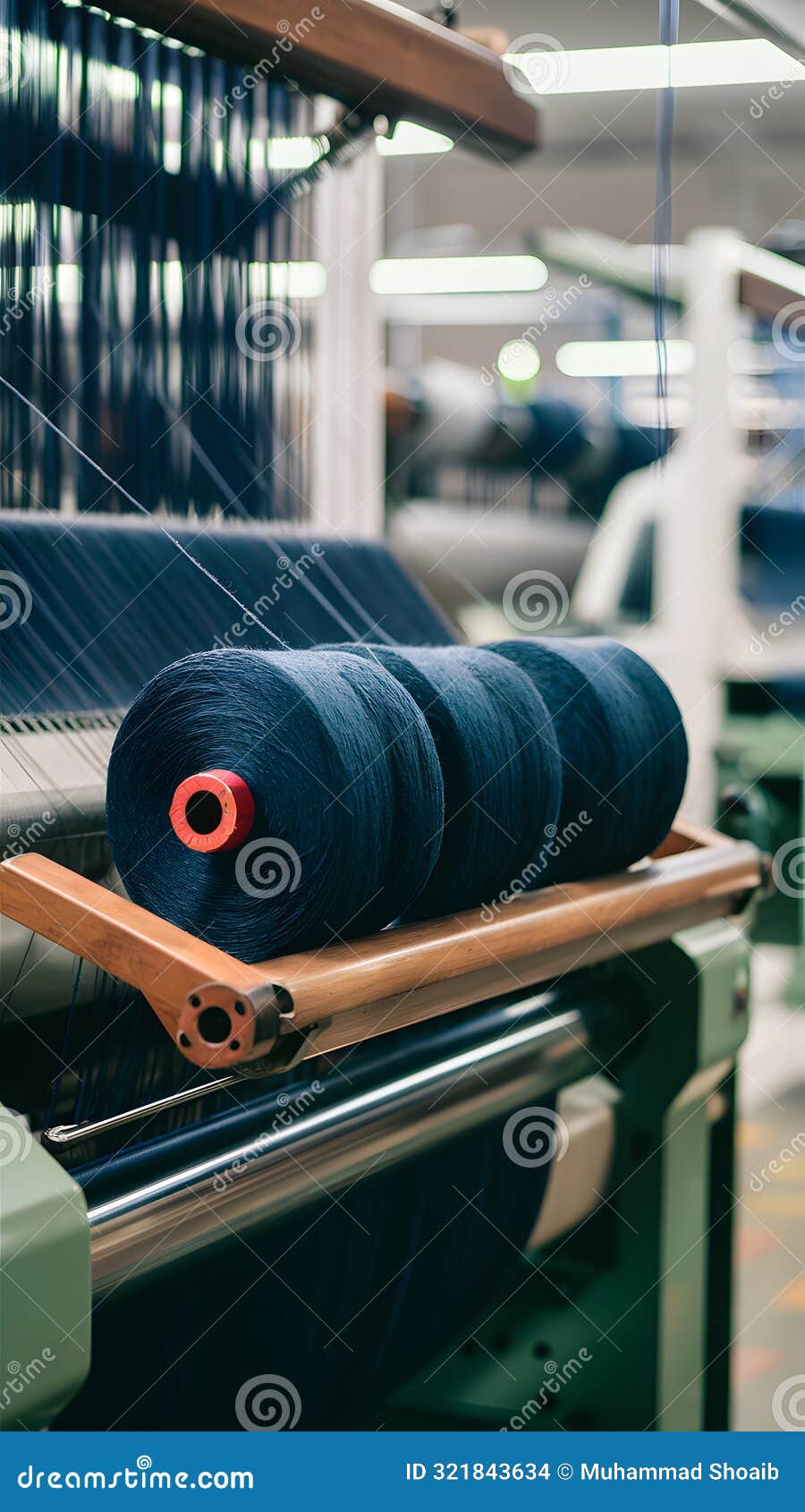 Textile Machine with Dark Thread Spools in Well Lit Production Facility ...