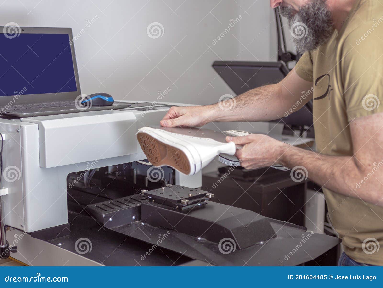 Textile Printing Worker Preparing Machine for Customization in Sneakers ...