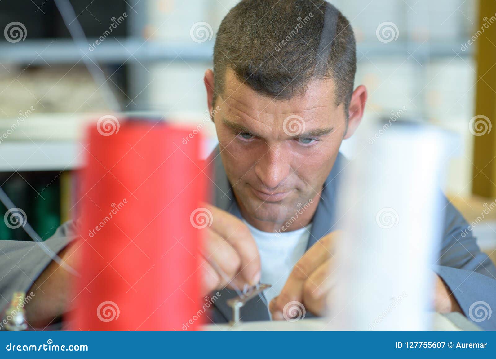 Textile weaver at work stock image. Image of operator - 127755607