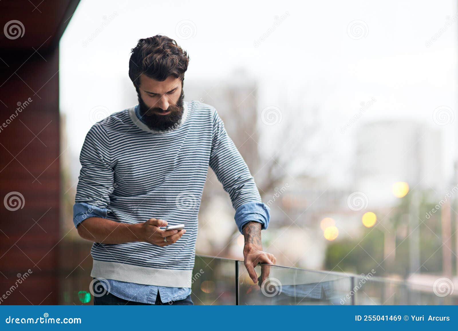 Texting a Client with the Latest Updates. a Young Creative Texting on a ...