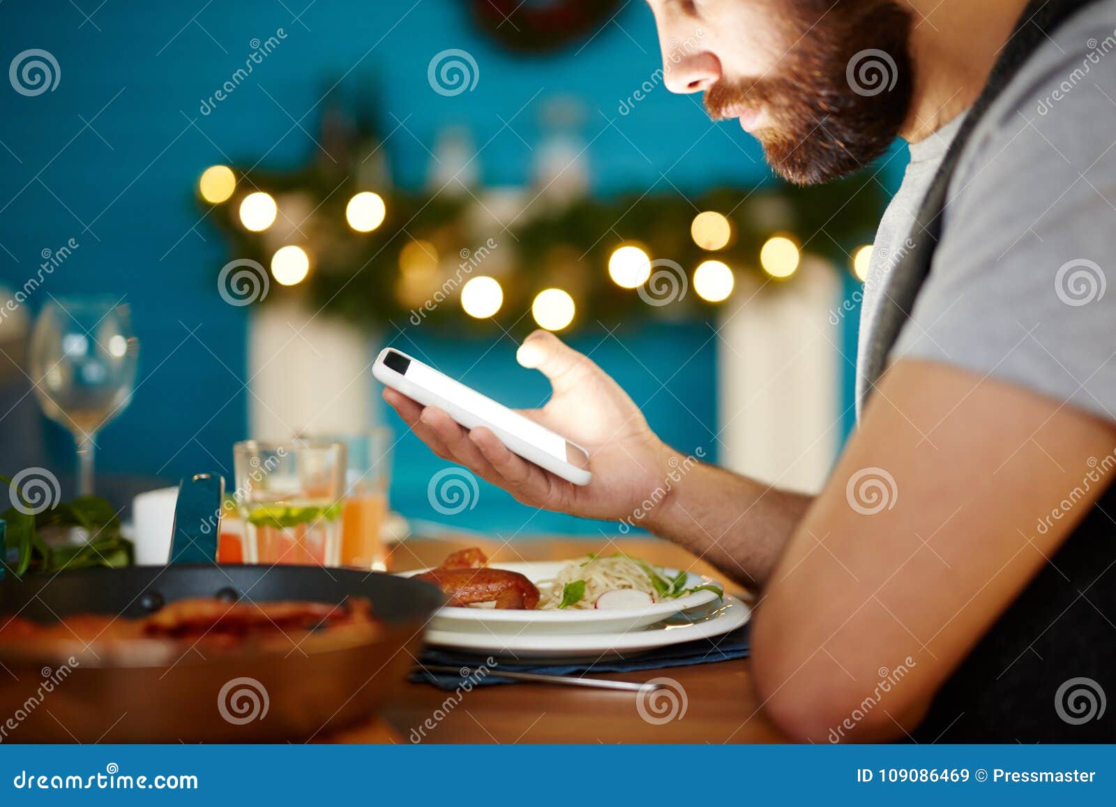 Texting by dinner stock image. Image of contemporary - 109086469