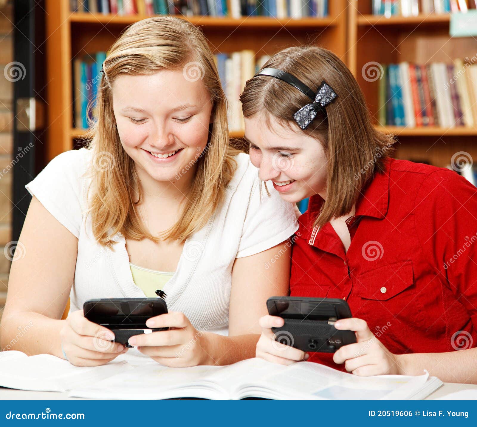 Texting in School stock photo. Image of blond, pretty - 20519606