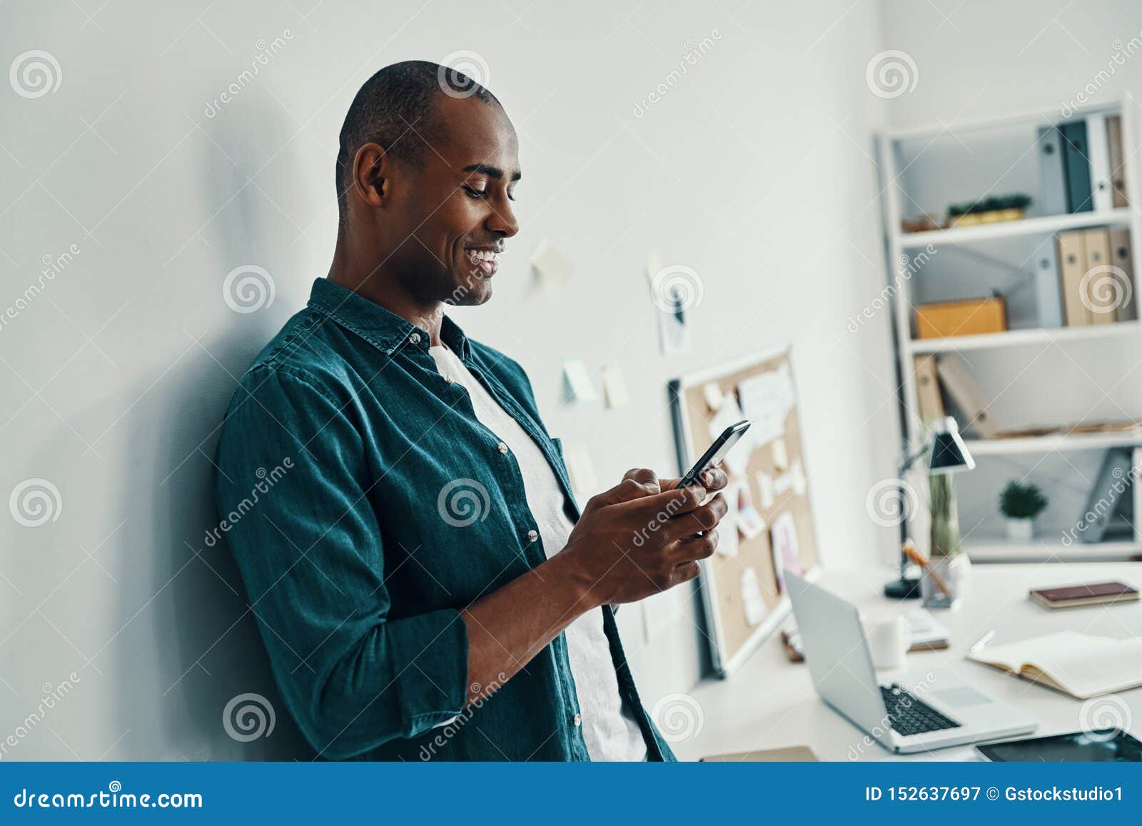 Texting someone. stock image. Image of handsome, indoors - 152637697