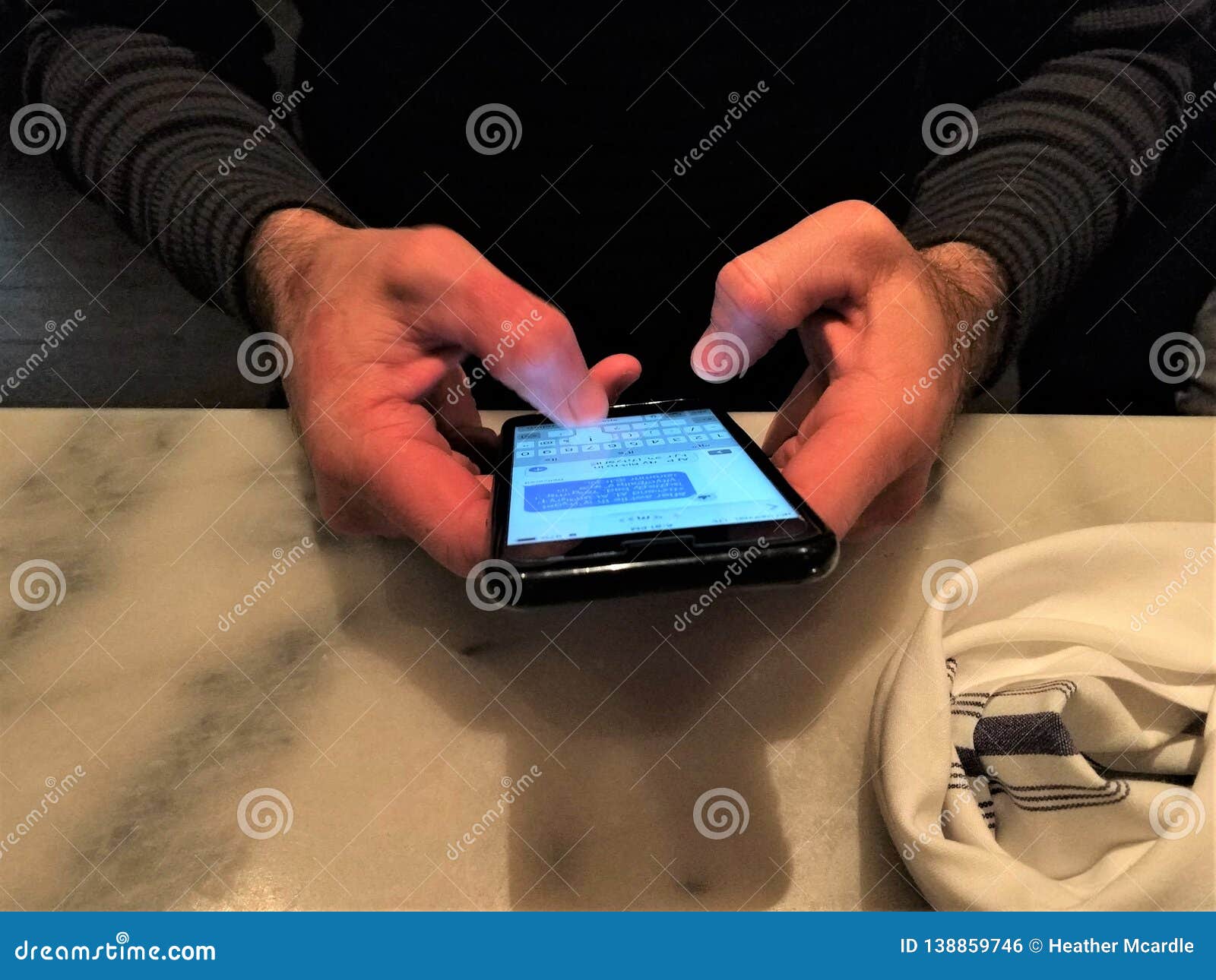 Texting at the table stock photo. Image of grey, battery - 138859746