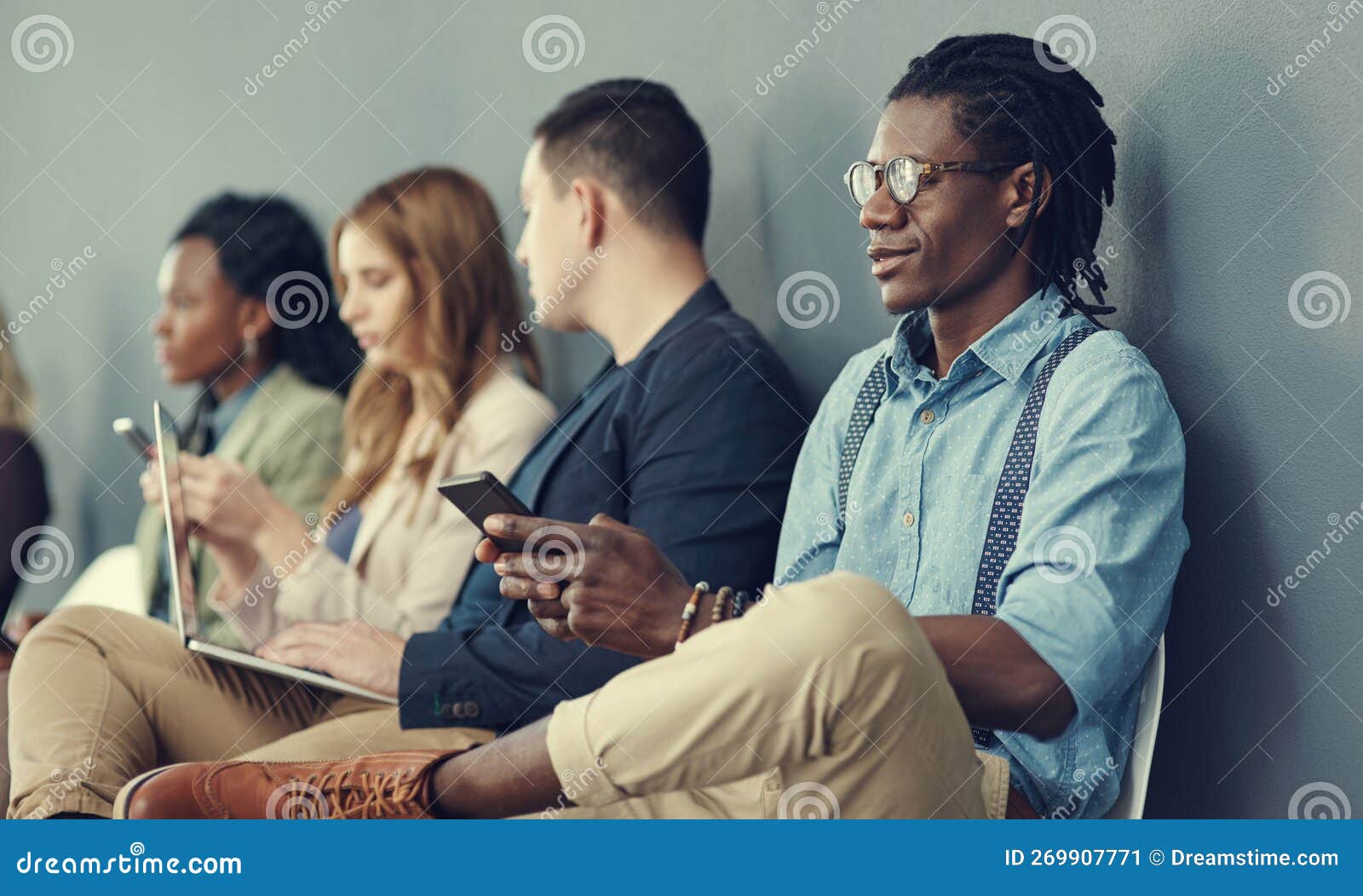 Texting the Time Away until the Interview. a Group of Businesspeople ...