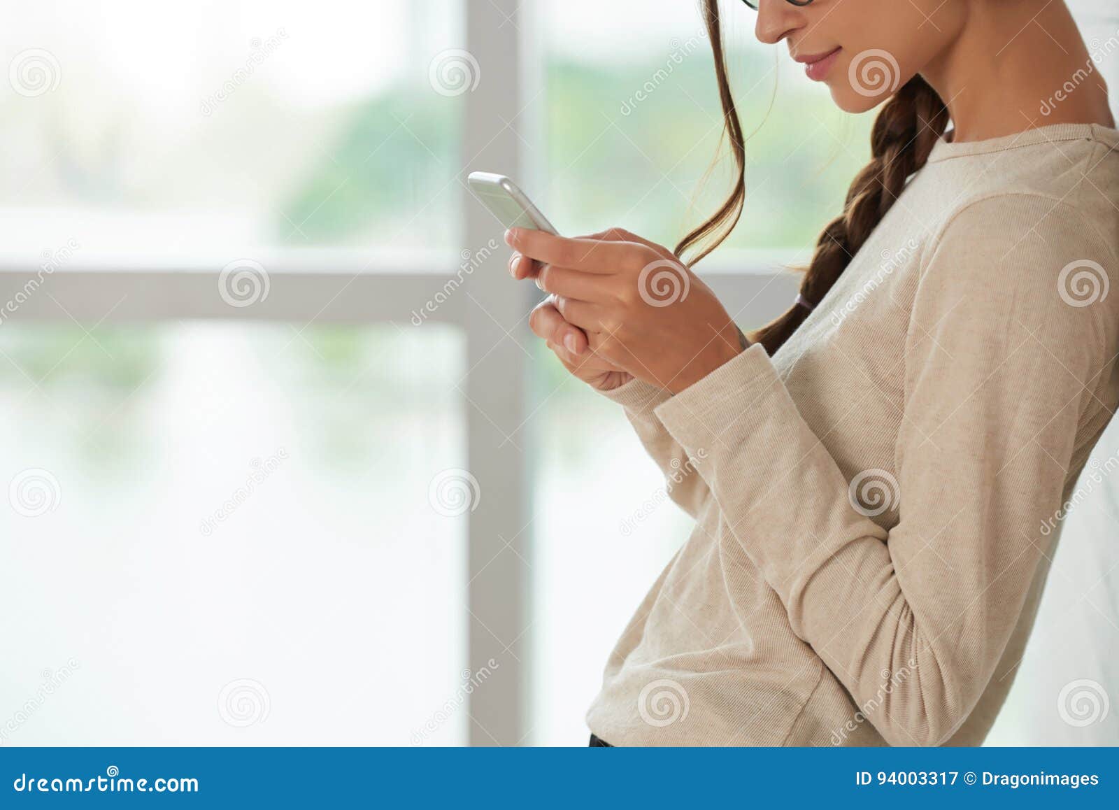 Texting woman stock image. Image of wall, student, glasses - 94003317