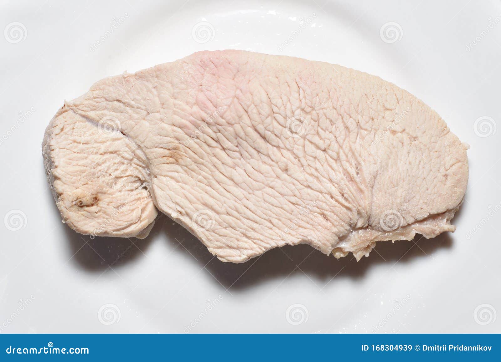 The Texture of Boiled Turkey Meat. Boiled Turkey Meat on a Plate Stock ...