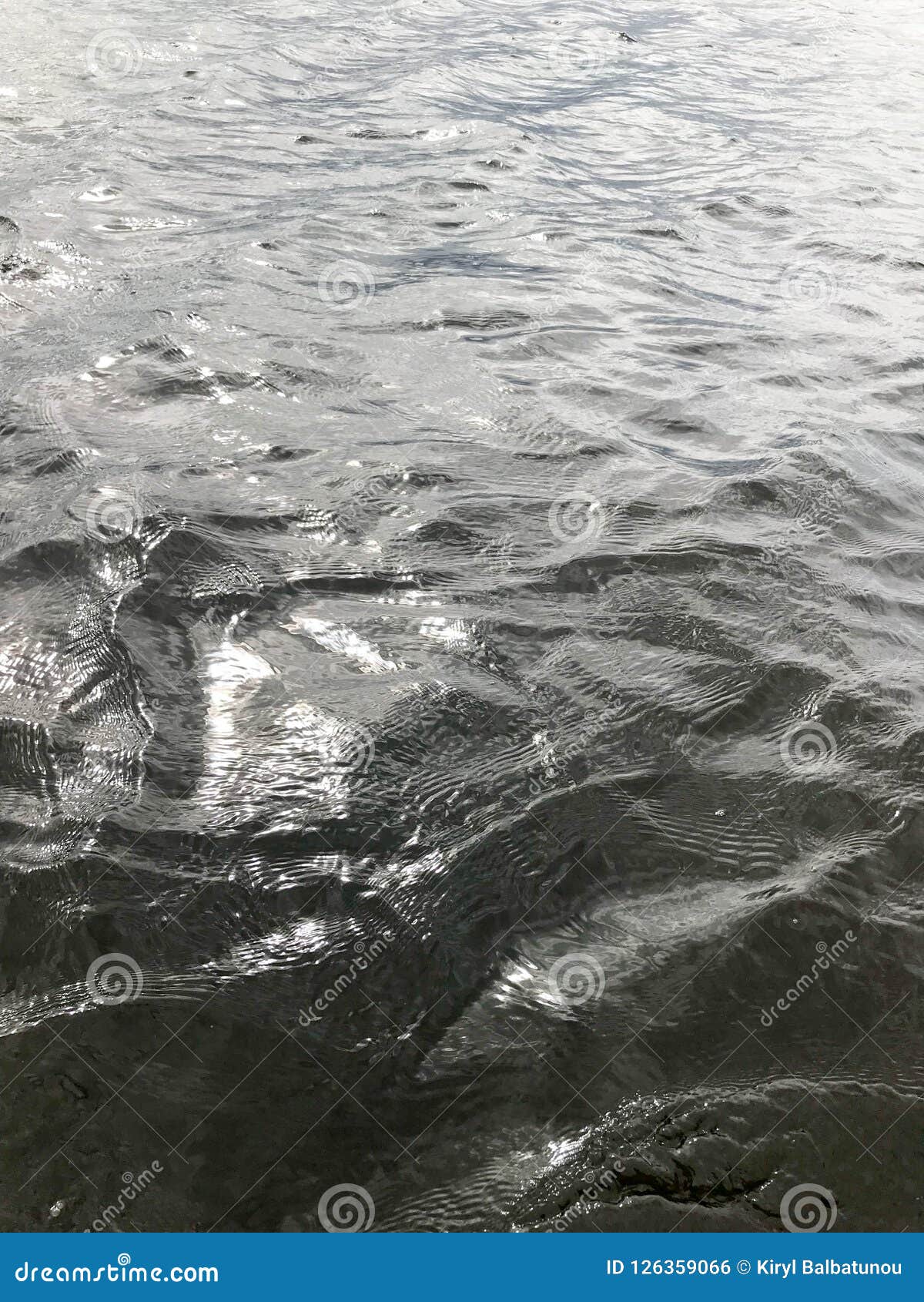 Texture of Dark Black Cold Water with Waves of Ripples Rippling. the ...