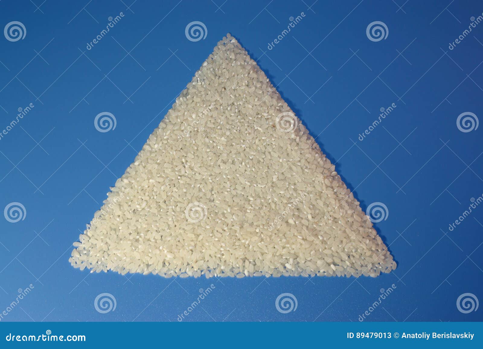 The Texture of the Grains of Rice on a Blue Background Stock Image ...