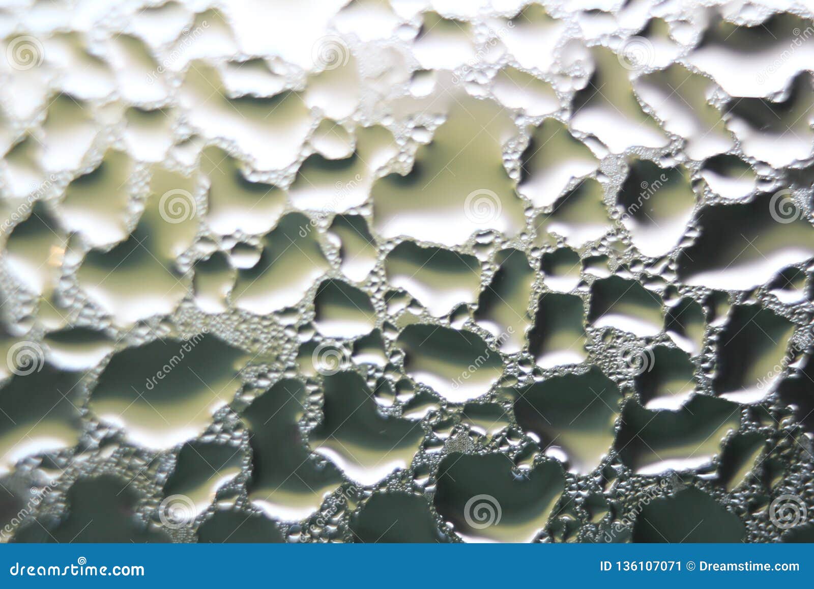 Silver Water drop on glass stock image. Image of wall - 136107071