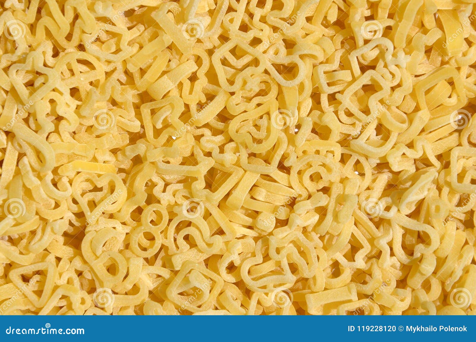 Texture of a Lot of Curly Raw Yellow Pasta Stock Photo - Image of ...