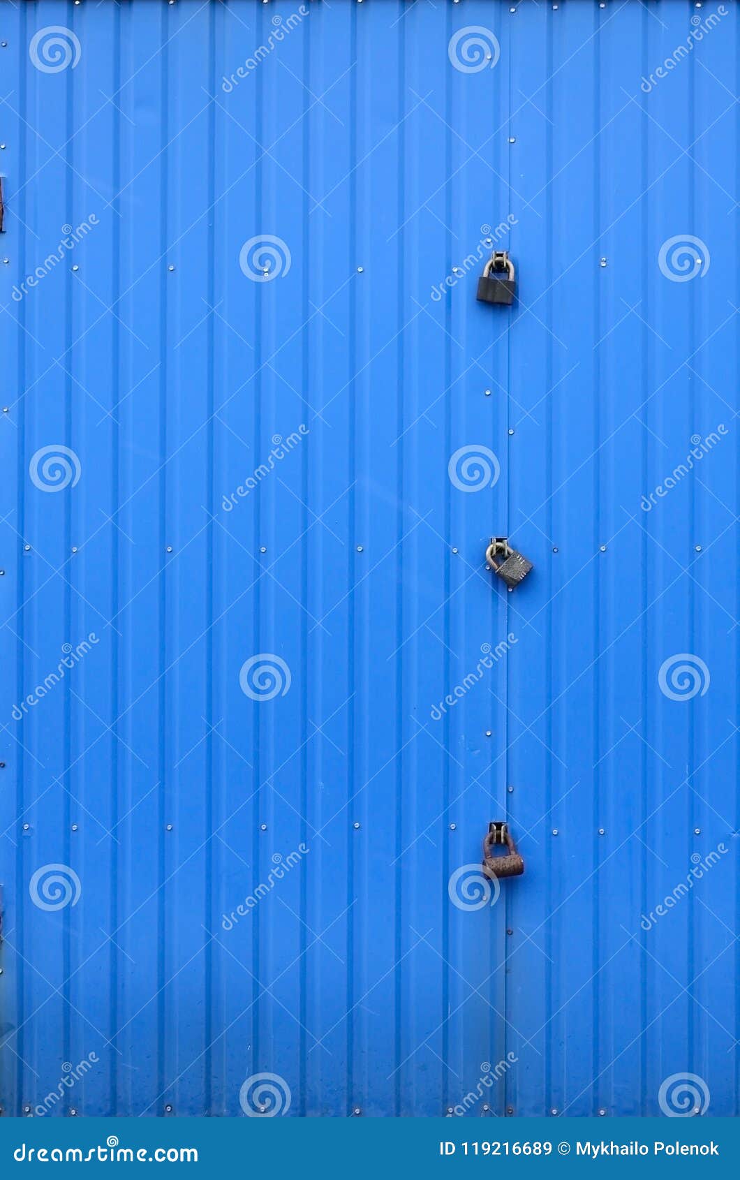 Texture of a Metal Blue Wall with a Gate Closed for Three Locks Stock ...
