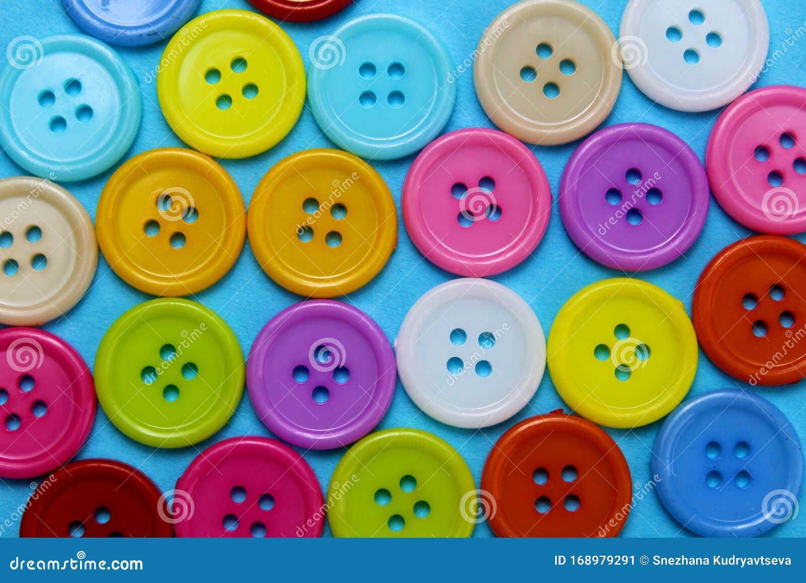 Texture of Multi-colored Buttons Laid Out on a Blue Surface Stock Image ...