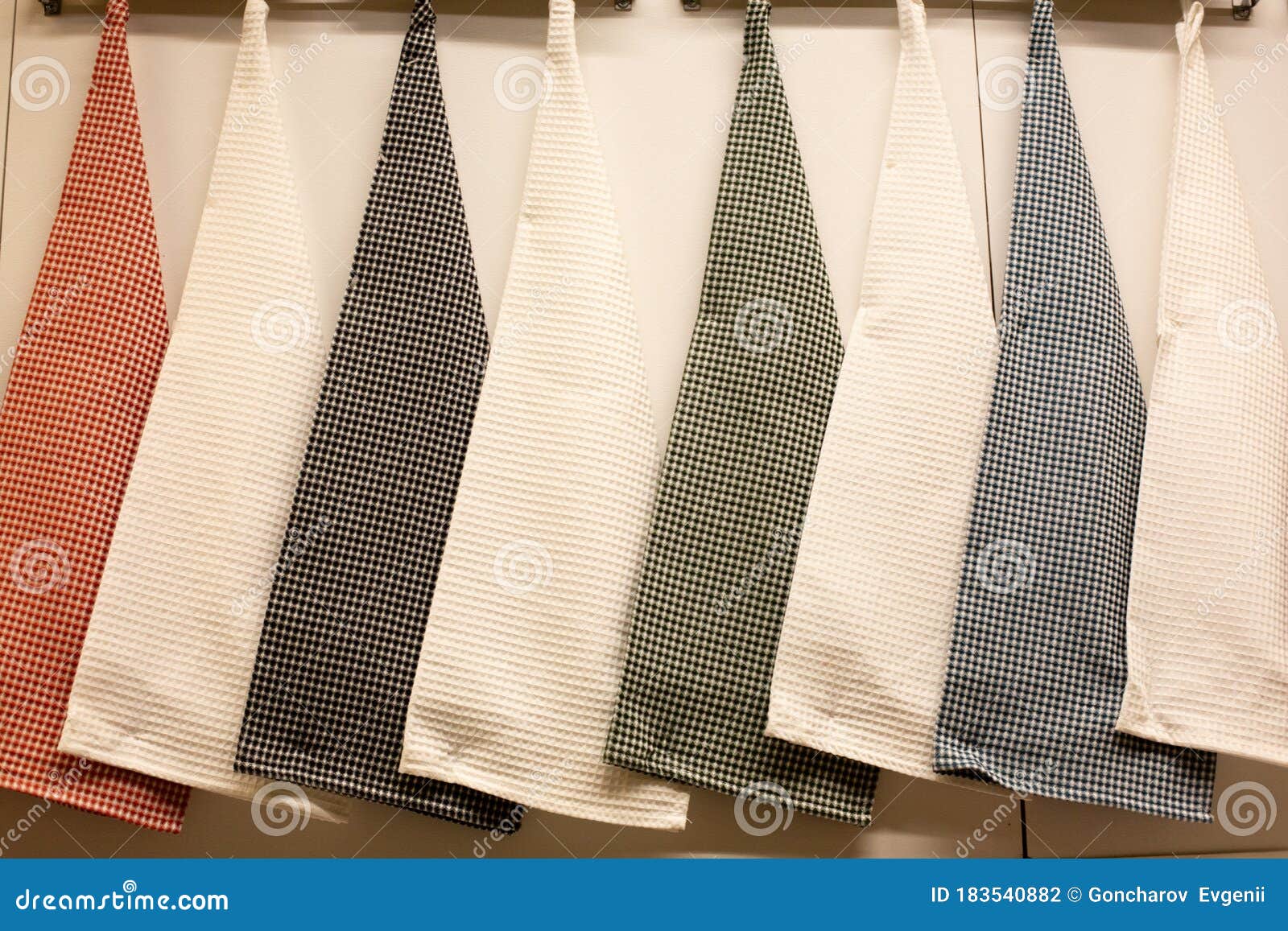 Texture of Multi-colored Kitchen Towels Hanging on a Hanger, Closeup ...