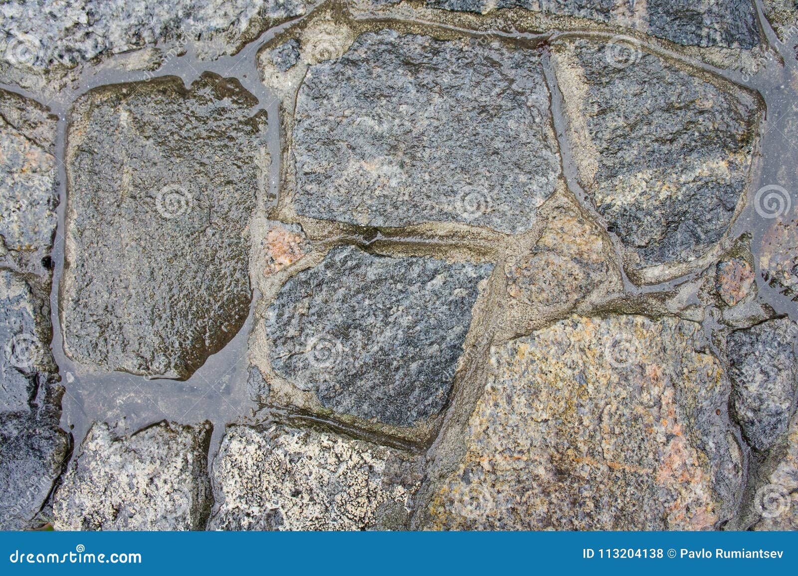 The Texture of the Old, Wet Granite in the Masonry of the Wall Stock ...