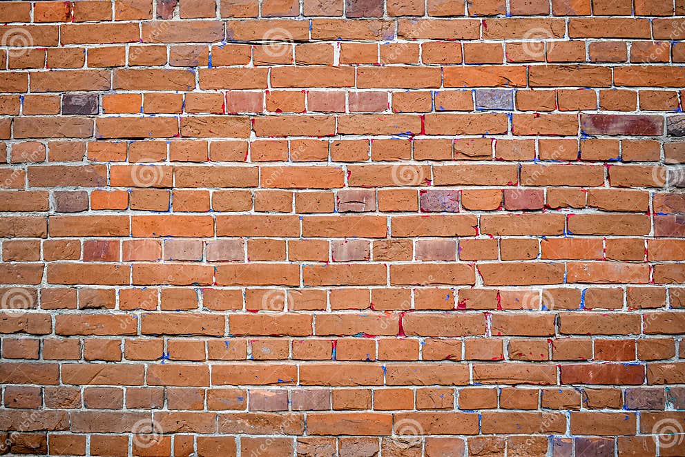 The Texture of Red Brick with Bright Splashes of Colored Paint. Stock ...