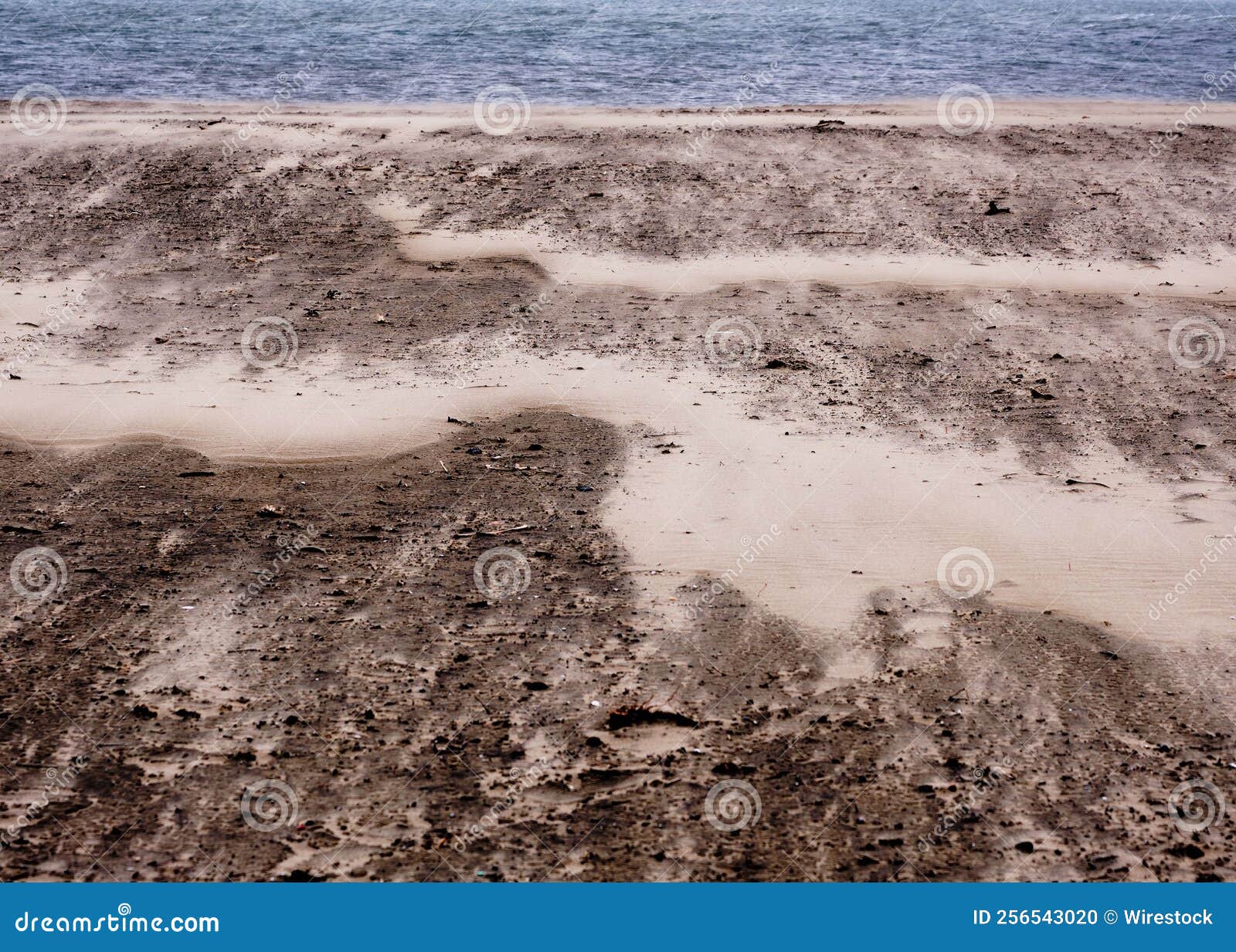 Texture of a Sand with Waves Washing the Beach in the Background Stock ...